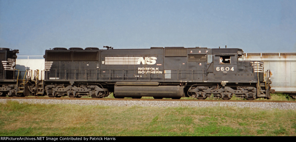 NS 6604 SD60 side view on NS drifting downgrade south parallel to the canal along Peoples Avenue ...